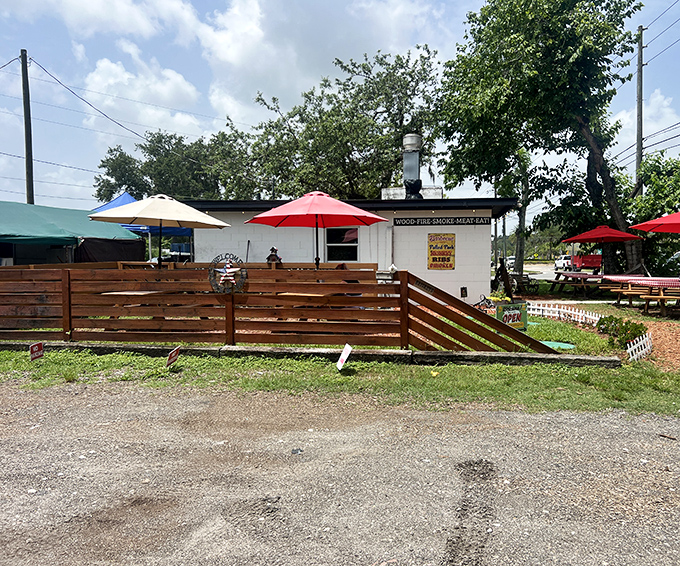 The unassuming exterior of Briskets BBQ Shack & Grill proves that culinary greatness often comes in small packages. That smokestack isn't just for show!