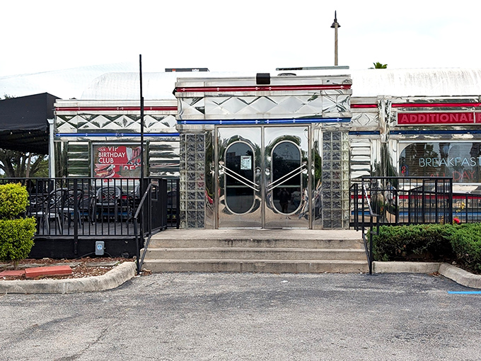 That gleaming silver exterior with bold red lettering isn't just eye-catching&mdash;it's a time portal to when Elvis was king and milkshakes were breakfast food.