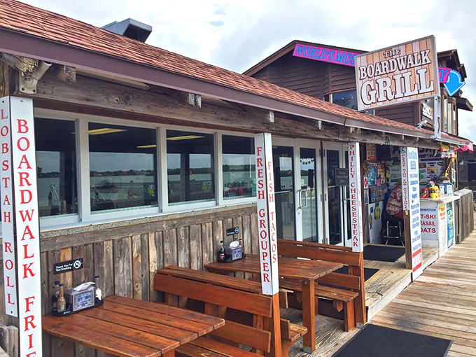 The weathered wooden exterior of Boardwalk Grill screams "authentic Florida seafood joint" louder than a seagull eyeing your lunch. 