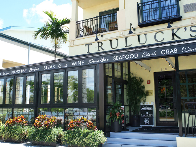 Truluck's exterior welcomes you with vibrant flower boxes and elegant windows that offer a tantalizing glimpse of the culinary paradise waiting inside.