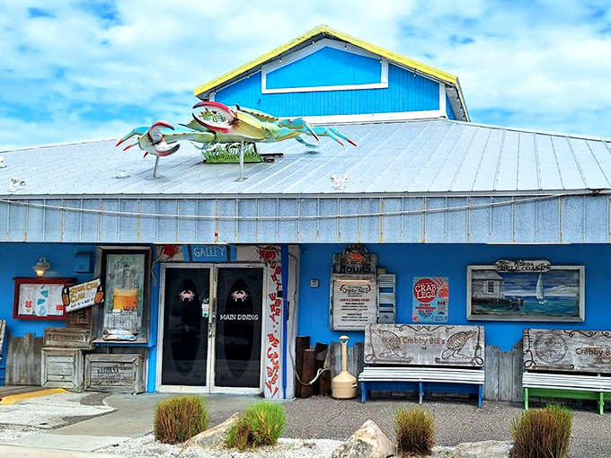 The iconic blue exterior of Crabby Bill's stands like a beacon of seafood salvation on Indian Rocks Beach, promising treasures from the Gulf within.