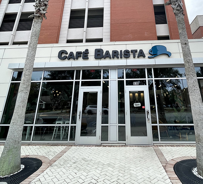 Caf&eacute; Barista's sleek exterior with its jaunty bowler hat logo promises a modern twist on breakfast classics in downtown Kissimmee.