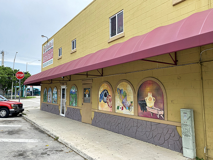 The unassuming tan exterior with vibrant painted windows tells you everything: this isn't about flash, it's about flavor. Authentic Mexican awaits inside.