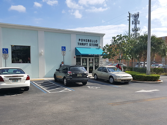 The unassuming exterior with its cheerful blue awning is like finding a secret portal to bargain heaven. No fancy frills needed when treasures await inside.