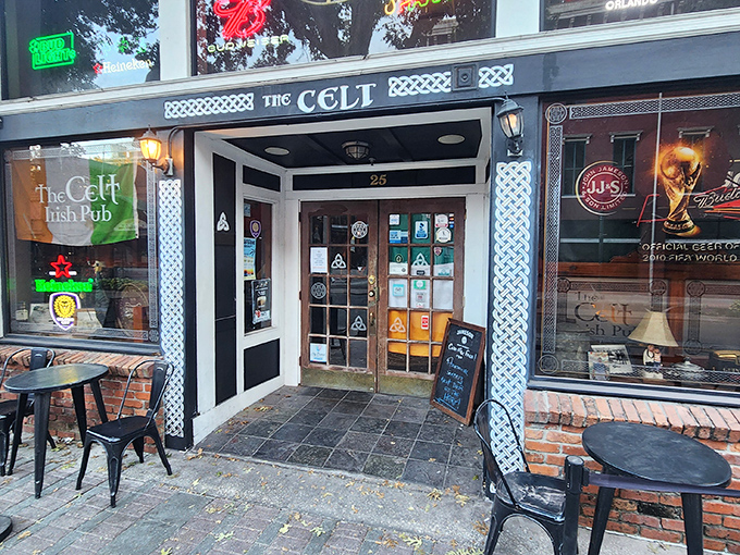 The unassuming storefront of Harp & Celt beckons like an old friend on Magnolia Avenue, promising authentic Irish comfort in downtown Orlando's urban landscape.
