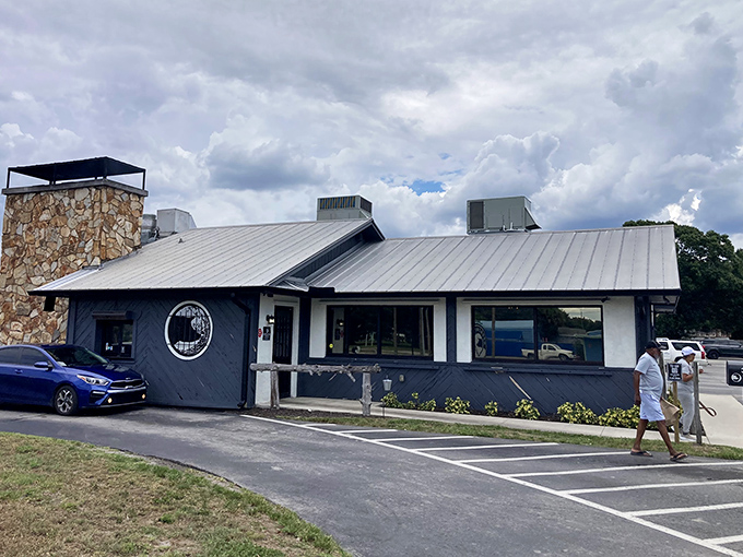 The unassuming exterior of Moonswiners Bar-B-Q stands like a smoke signal to hungry travelers&mdash;proof that the best BBQ joints often hide in plain sight.