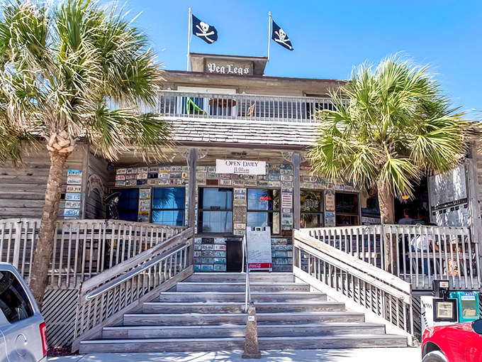 Pirate flags and palm trees welcome seafood seekers to this weathered wooden treasure chest of a restaurant on Pensacola Beach.