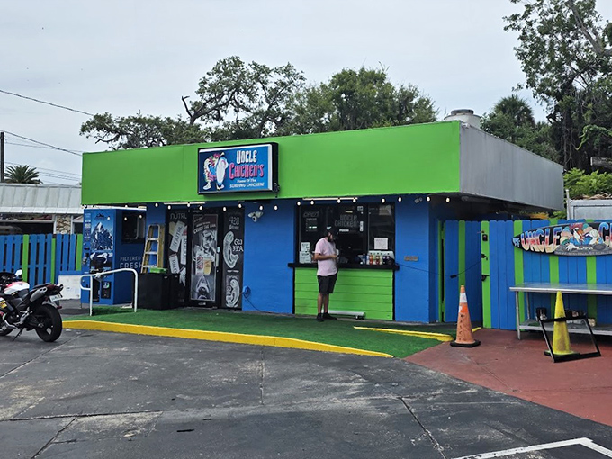 The lime green and electric blue exterior of Uncle Chicken's stands out like a tropical bird in a penguin convention. Florida roadside charm at its finest!