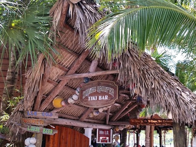 The entrance says it all &ndash; palm fronds, weathered wood, and that iconic sign promising the kind of Florida experience you can't manufacture in a boardroom.