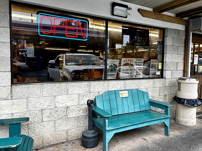 Those crossed wooden doors might as well be pearly gates for barbecue pilgrims. The unassuming exterior hides smoky treasures within.