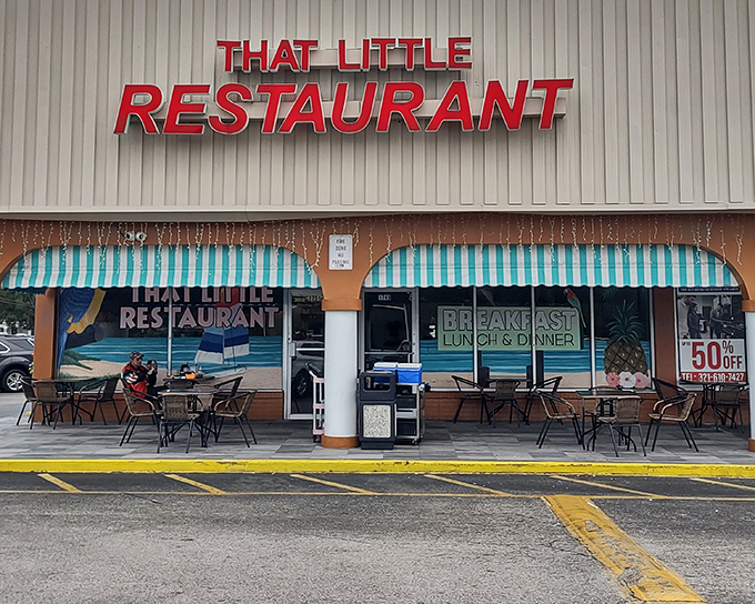 The bright red sign beckons like a lighthouse for hungry souls. That Little Restaurant's unassuming strip mall exterior hides culinary treasures within.