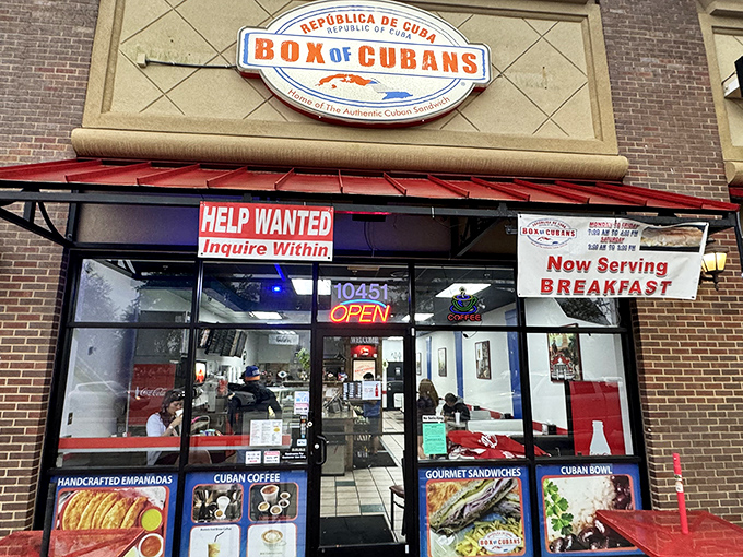 The unassuming storefront promises authentic Cuban flavors without the airfare. Red awnings and that iconic sign beckon sandwich seekers from miles around.