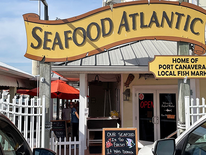 The unassuming exterior of Seafood Atlantic stands like a beacon for seafood lovers, with its cheerful yellow sign promising treasures from the deep.
