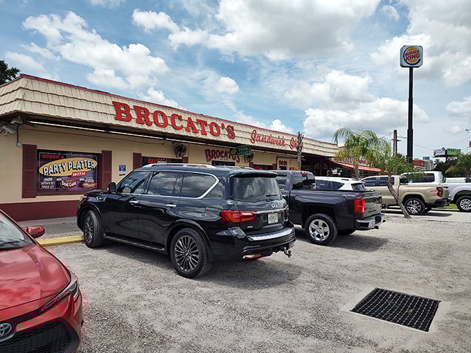 The iconic red lettering of Brocato's beckons hungry travelers like a lighthouse for sandwich lovers. Tampa's culinary landmark stands unpretentious yet proud.