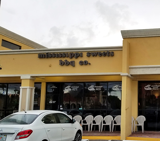 That cheerful yellow exterior might fool you, but inside lies barbecue magic that'll change your life forever.