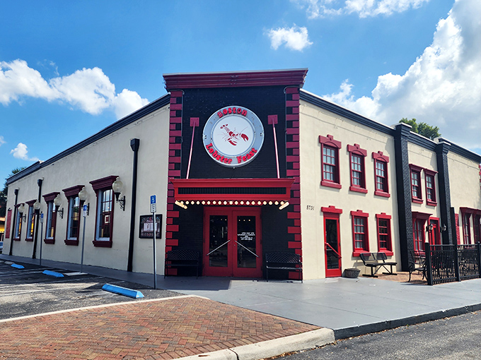 The iconic red and white exterior of Boston Lobster Feast stands out like a culinary lighthouse, beckoning seafood lovers from across Florida.