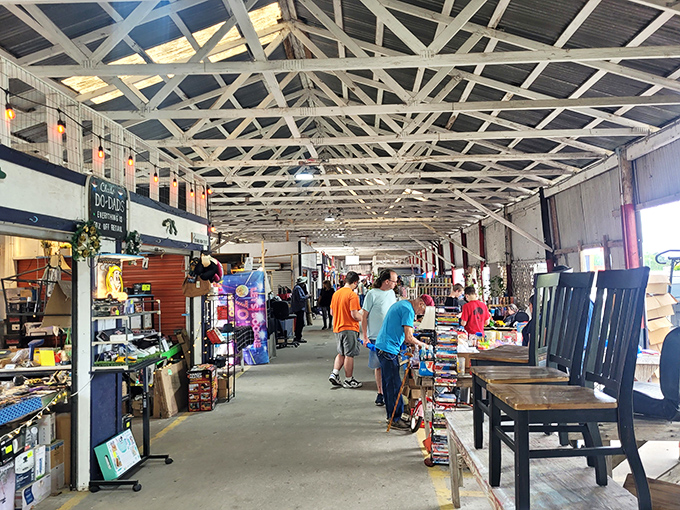 The covered pavilions stretch like canyons of commerce, where treasure hunters navigate aisles of possibility under industrial rafters that have witnessed countless bargain victories.
