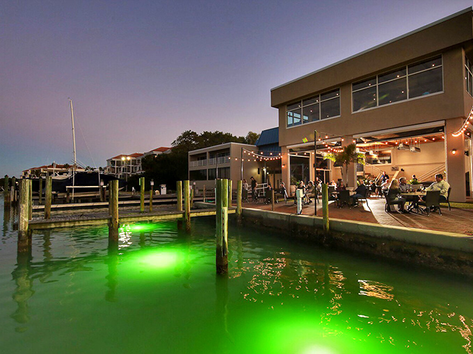 The unassuming beige exterior of Dry Dock Waterfront Grill proves once again that in Florida, architectural modesty often hides culinary magnificence.