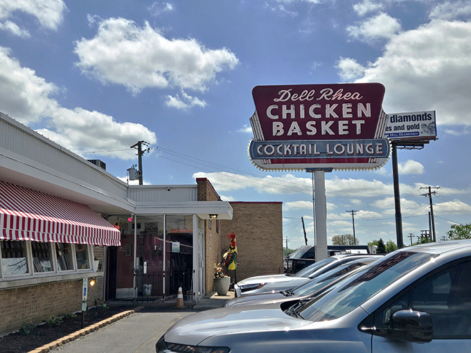 The iconic red and white awning beckons hungry travelers like a Route 66 mirage. This isn't just a restaurant&mdash;it's a time machine with fried chicken.