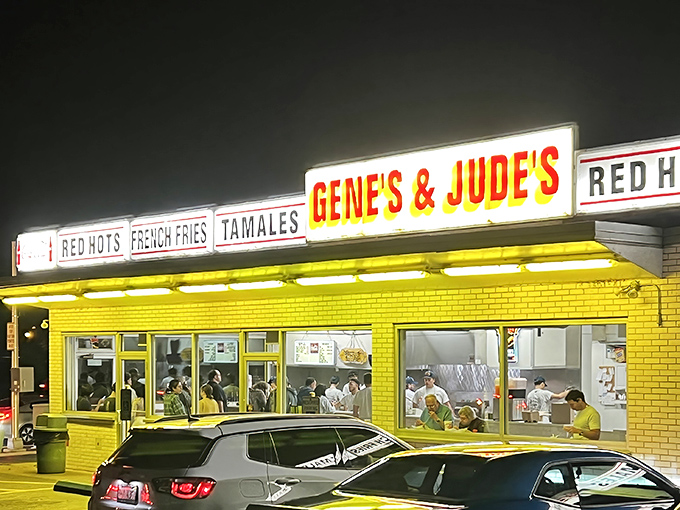 The iconic blue and white exterior of Gene & Jude's stands as a beacon for hot dog pilgrims, its vintage signage promising simple pleasures done right.