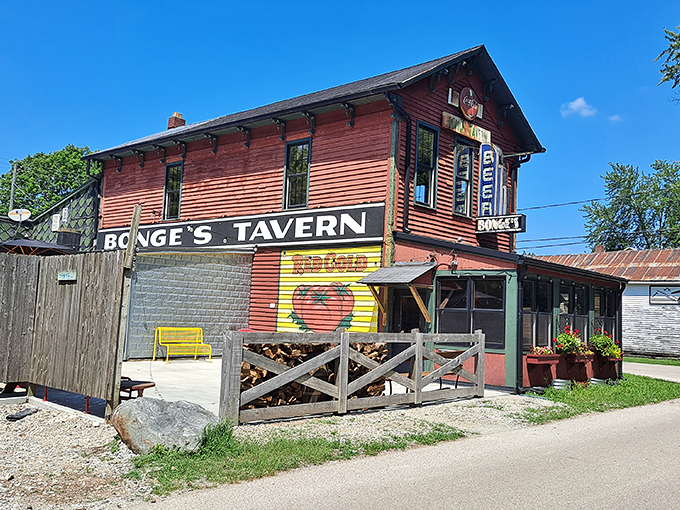 The unassuming red exterior of Bonge's Tavern stands like a culinary lighthouse in rural Indiana, beckoning hungry pilgrims to its legendary prime rib sanctuary.