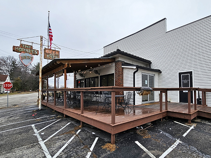 That vintage sign has seen better days, but like your favorite uncle's stories, it only gets more charming with age. The outdoor seating beckons with rustic simplicity.