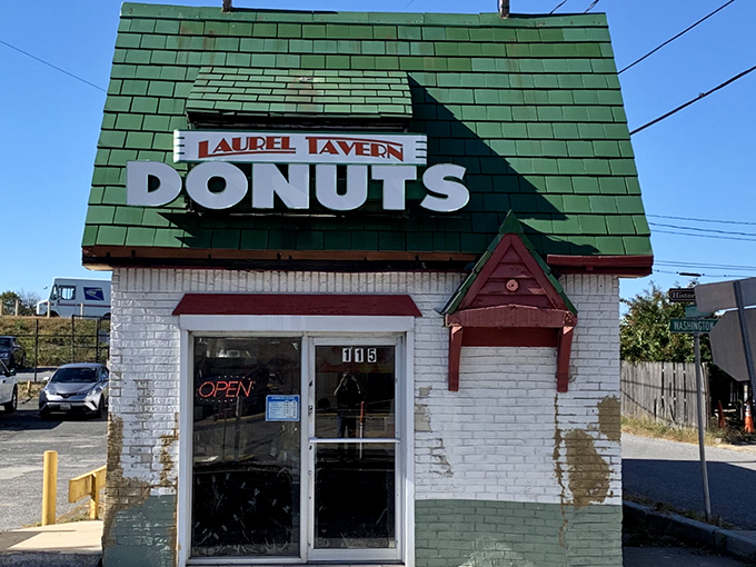 The little donut shop with the big green roof stands like a beacon of sweetness on Washington Boulevard, promising morning salvation one glazed ring at a time.