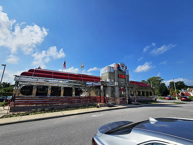 The gleaming chrome exterior of Double T Diner stands like a time machine on wheels, Maryland flags waving a welcome to hungry travelers.