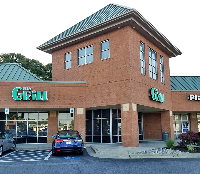 The brick exterior with its bold green sign promises no pretension&mdash;just honest food that speaks volumes without needing a fancy facade.