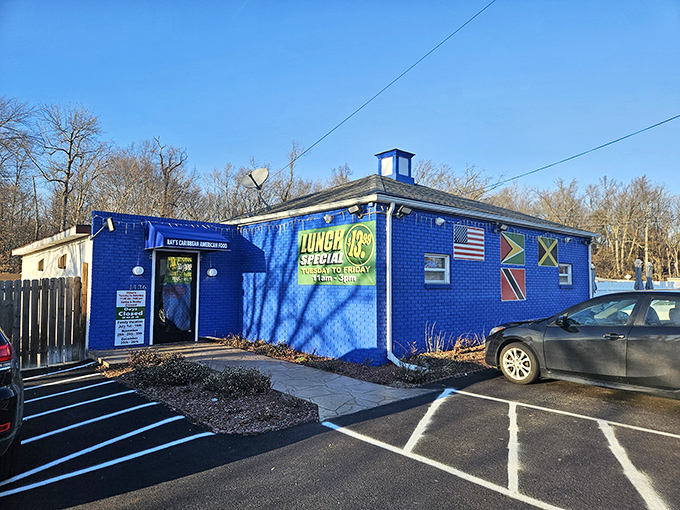 The little blue building that could! Ray's vibrant exterior stands out like a Caribbean jewel in Aberdeen's landscape, promising tropical flavors inside.
