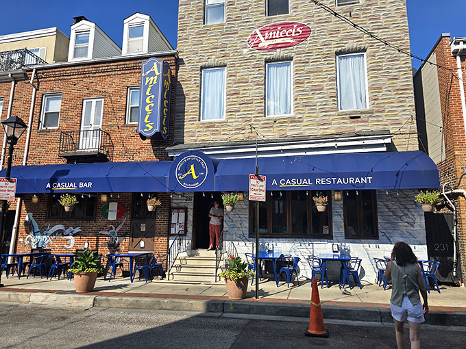 That blue awning beckons like a beacon of Italian comfort in Baltimore's historic Little Italy neighborhood.