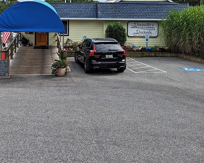 The unassuming yellow exterior with its welcoming blue awning is like that friend who doesn't brag but always delivers an unforgettable meal.