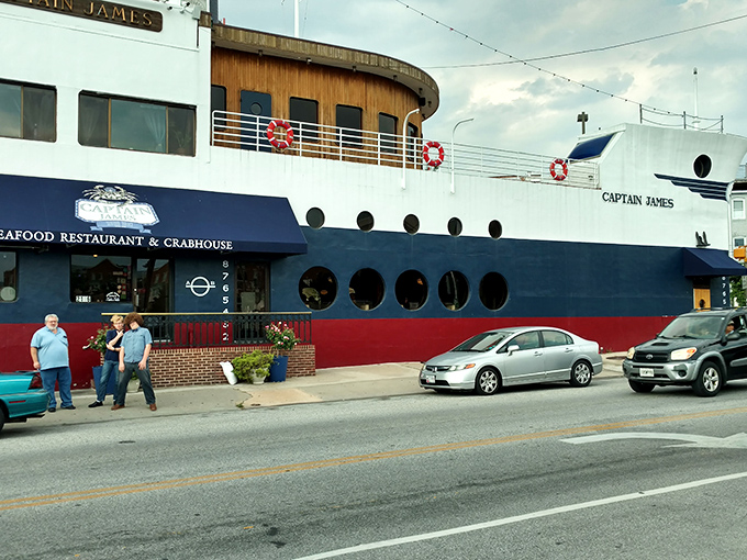 The ultimate maritime mirage: a full-sized ship permanently docked on Boston Street, proving Baltimore's seafood scene has officially gone overboard.