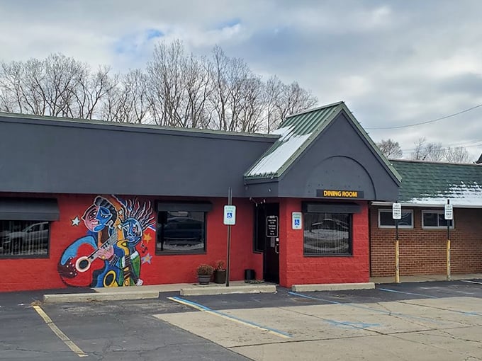 That colorful mural isn't just decoration &ndash; it's a promise of the smoky adventures waiting inside this Fenton barbecue haven.