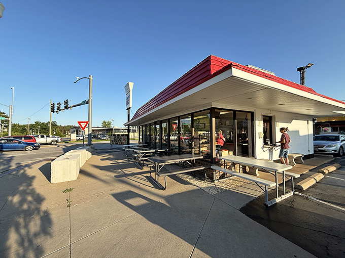 The iconic red-topped roof of Gordon's Stoplight Drive-In stands as a beacon of hope for hungry travelers. Simple, unpretentious, and promising delicious comfort food inside.