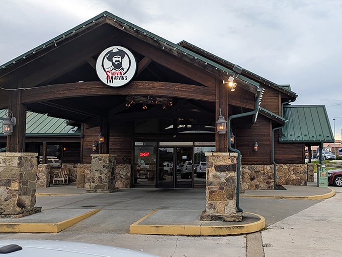 The rustic lodge-style exterior of Starvin Marvin's beckons hungry travelers like a siren song for seafood lovers in the Ozark hills.