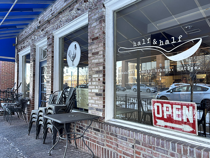 The exposed brick exterior of Half & Half beckons like an old friend, promising comfort and culinary delight behind that cheerful "OPEN" sign.