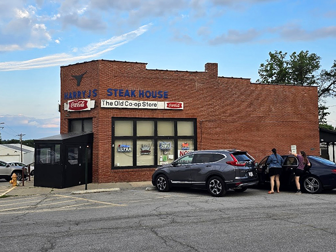 That unassuming brick facade hides culinary treasures that would make city steakhouses weep with envy.