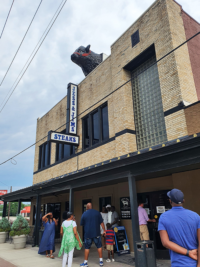 The iconic cow silhouette stands guard atop Jess & Jim's brick building, a beacon for carnivores that's been calling hungry Missourians home for generations.