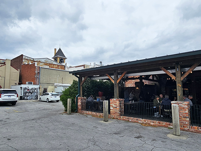 The charming red brick exterior of Morgan's Tavern & Grill beckons from Middle Street, promising comfort and hospitality behind those green doors.