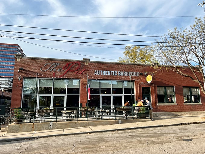 The brick exterior of The Pit stands like a temple to smoked meat, its unassuming fa&ccedil;ade hiding flavor explosions waiting to happen inside.