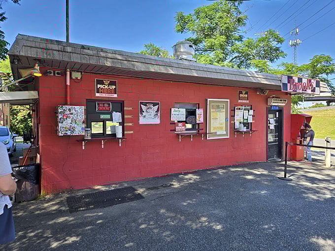 The little red cinderblock building that could. Brooks' Sandwich House stands defiantly unchanged while Charlotte's NoDa neighborhood transforms around it.