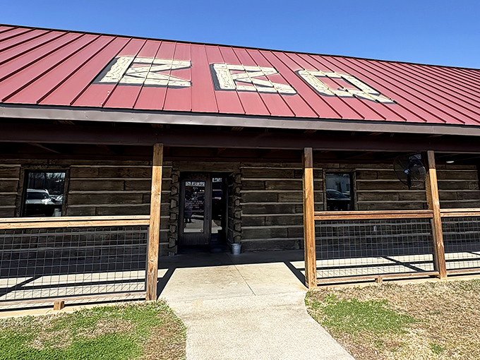 The rustic log cabin exterior with its signature red roof isn't trying to impress anyone&mdash;until you taste what's happening inside.