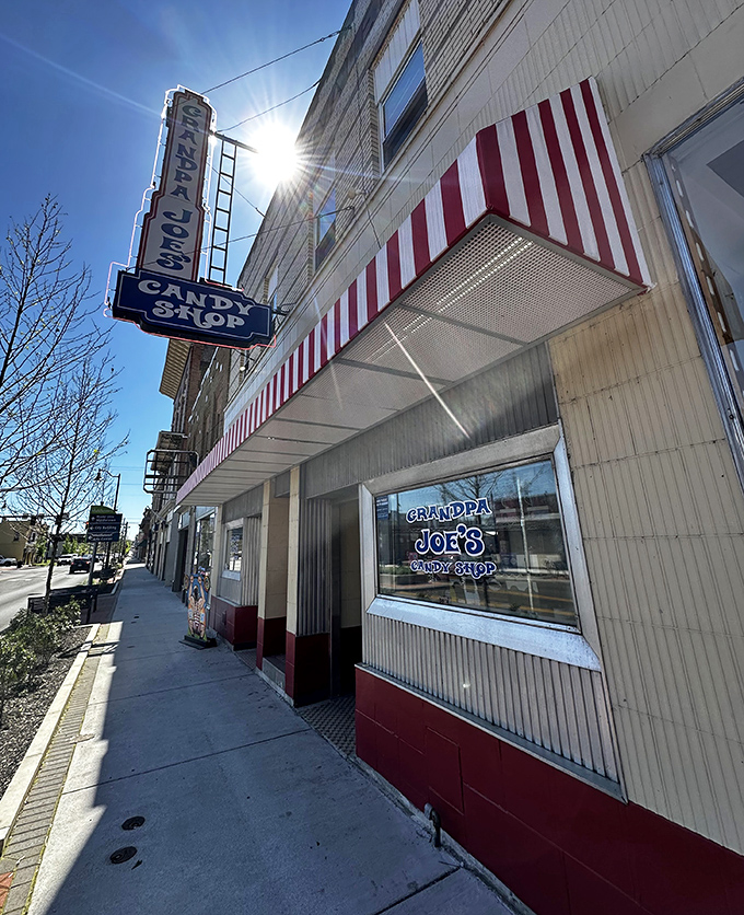 The classic red and white awning and vintage neon sign of Grandpa Joe's beckons like a sugar-coated time machine on Middletown's main drag.