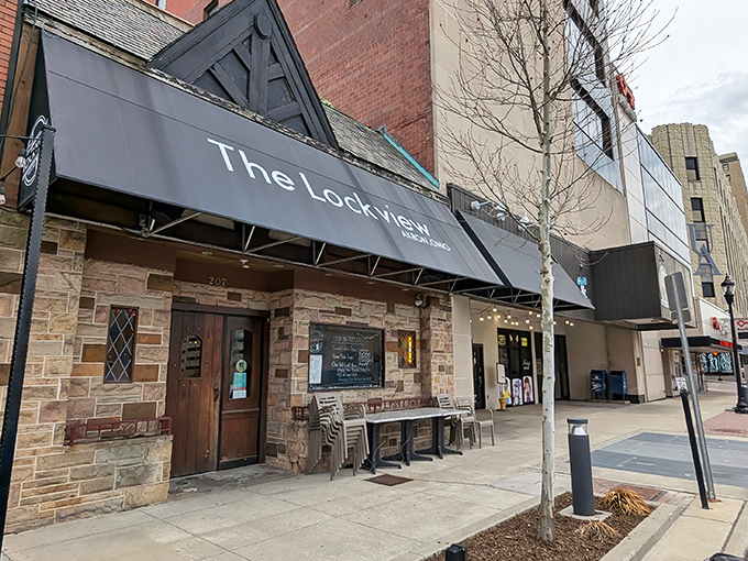 The stone facade of The Lockview stands like a culinary fortress in downtown Akron, promising comfort food treasures behind its unassuming exterior.