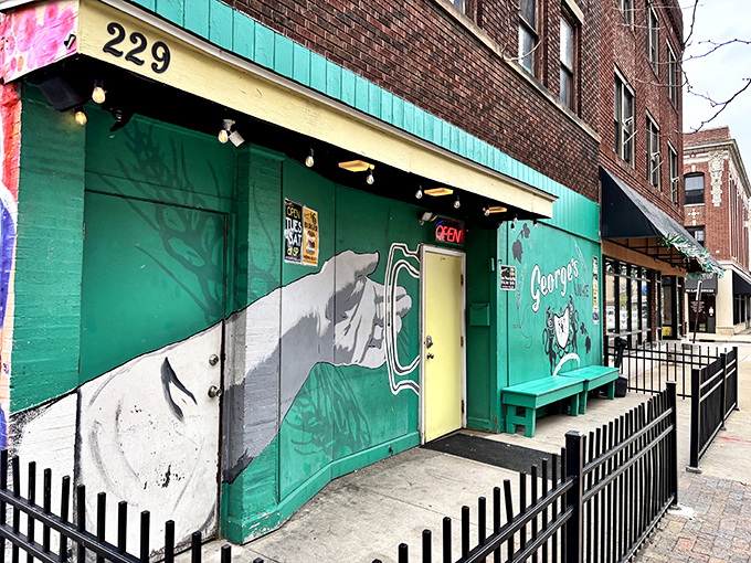 The mural-adorned exterior of George's Lounge boldly proclaims "Where BURGERS Are ART" &ndash; a promise they deliver on with mouthwatering precision.
