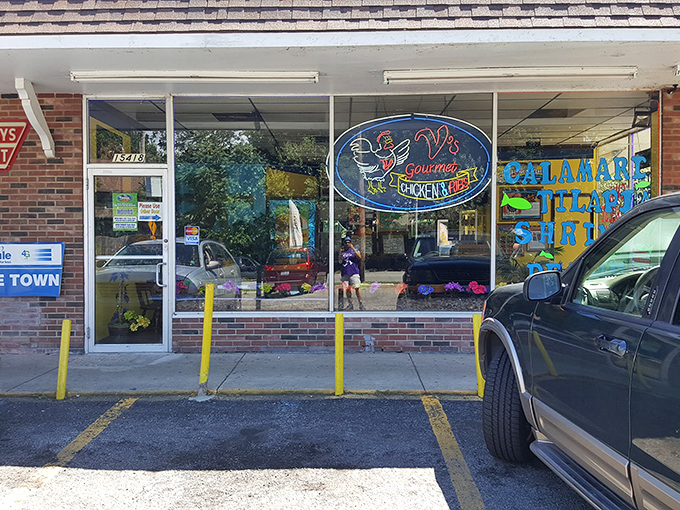The unassuming storefront of V's Gourmet Chicken might not look like a culinary destination, but those neon lights beckon like a beacon to fried chicken aficionados.