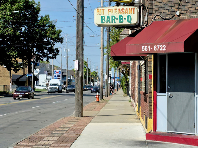 The unassuming storefront of MT Pleasant Bar-B-Q stands like a culinary lighthouse on Kinsman Road, beckoning hungry travelers with its vintage sign and promise of smoky delights.
