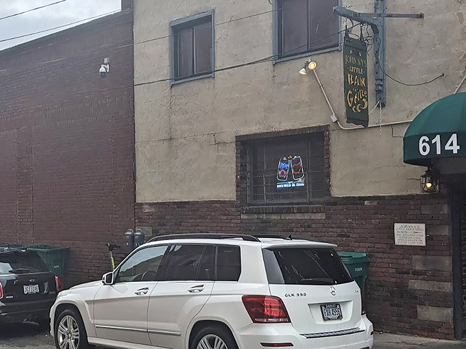 The unassuming entrance to Johnny's Little Bar might be Cleveland's best-kept secret. That vintage sign promises more than just drinks—it promises an experience.