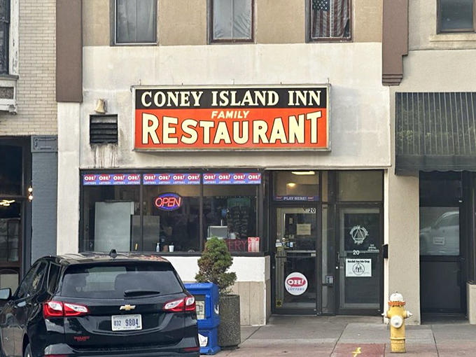 The unassuming storefront of Coney Island Inn beckons with its vintage sign &ndash; proof that culinary treasures often hide in plain sight.